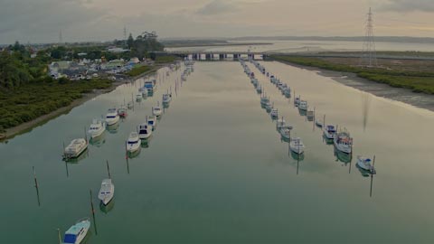 Boats moored in an estuary in Auckland